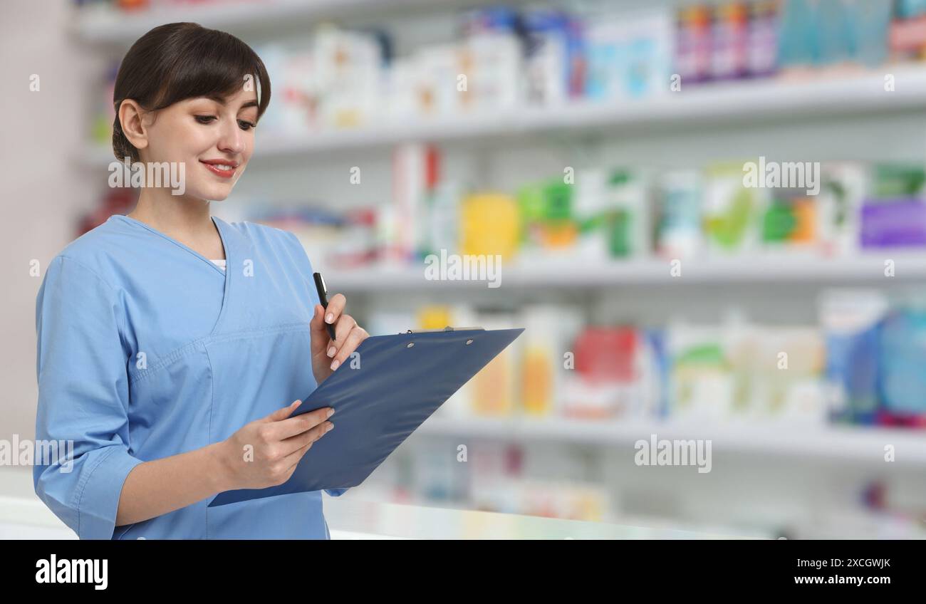 Positive pharmacist in uniform at drugstore. Space for text Stock Photo ...