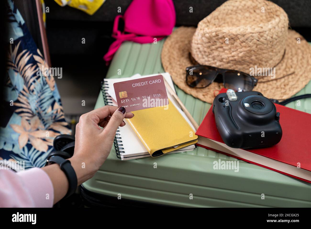 A suitcase, clothes, passport, and credit card ready for travel Stock ...