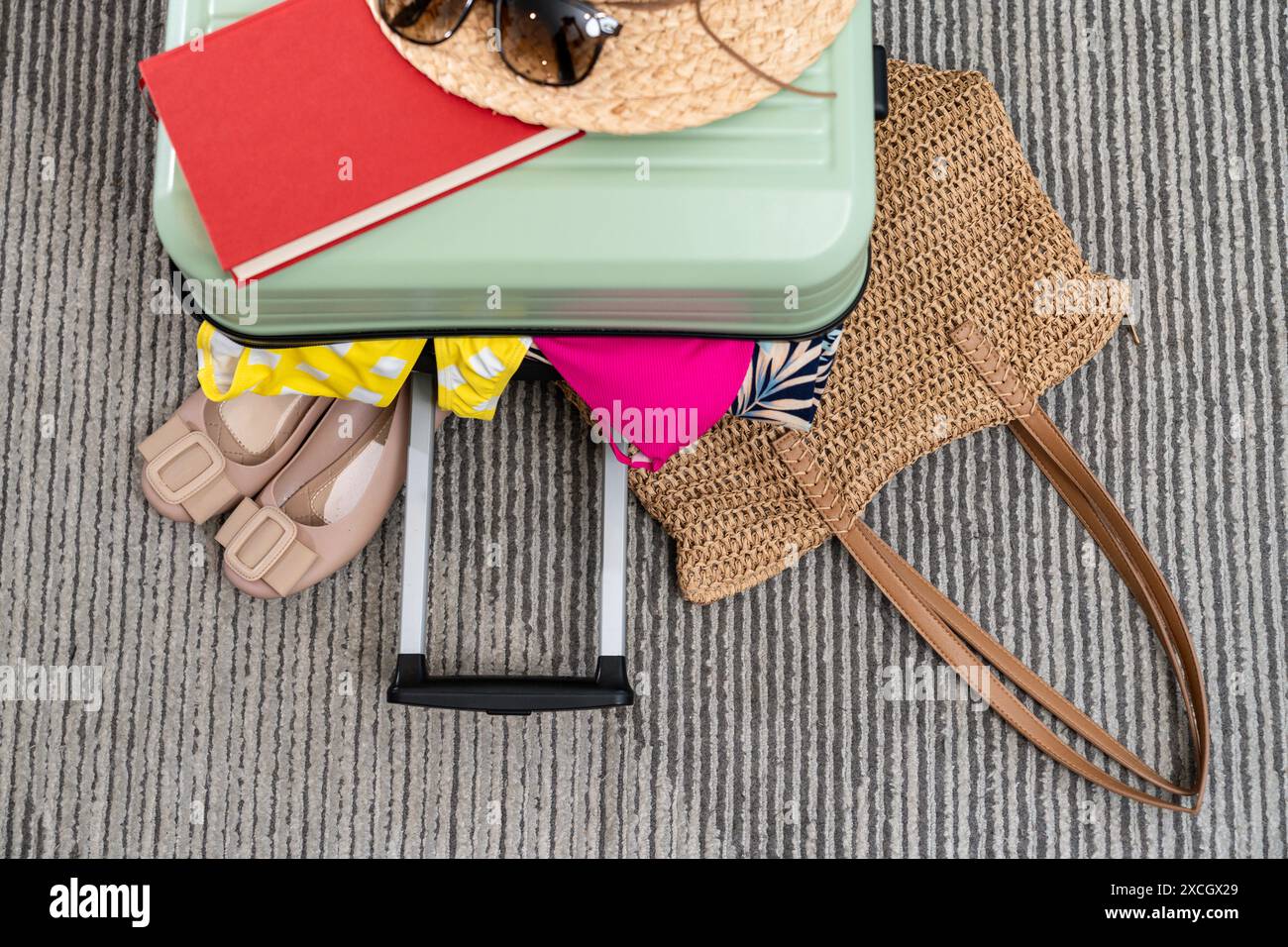 A suitcase, clothes, passport, and credit card ready for travel Stock ...