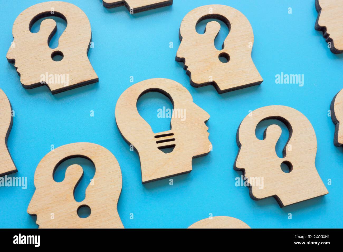 Creative thinking and problem solving. Heads with question marks and a ...