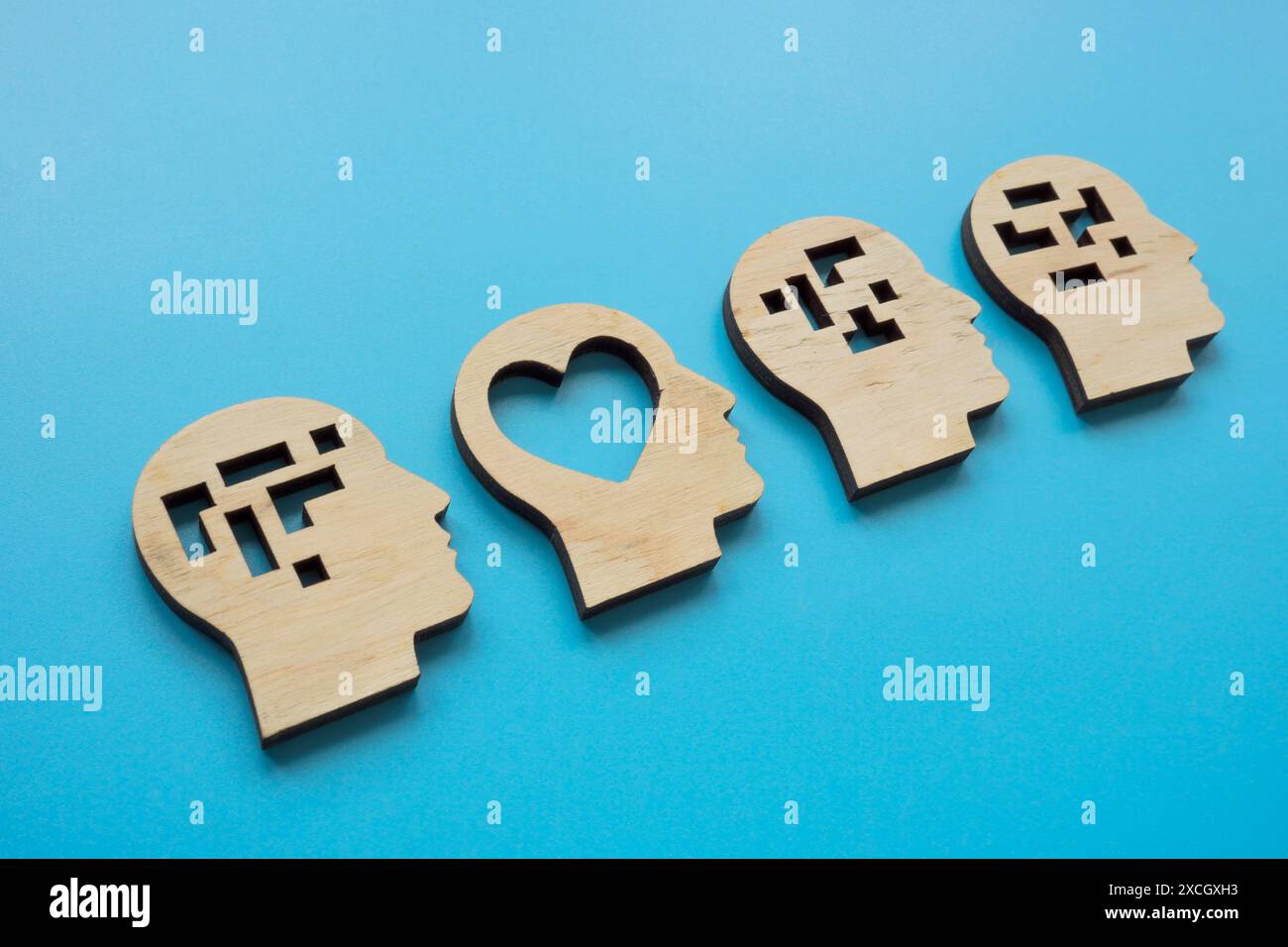 Figures of heads with heart and logical structures. Emotional ...