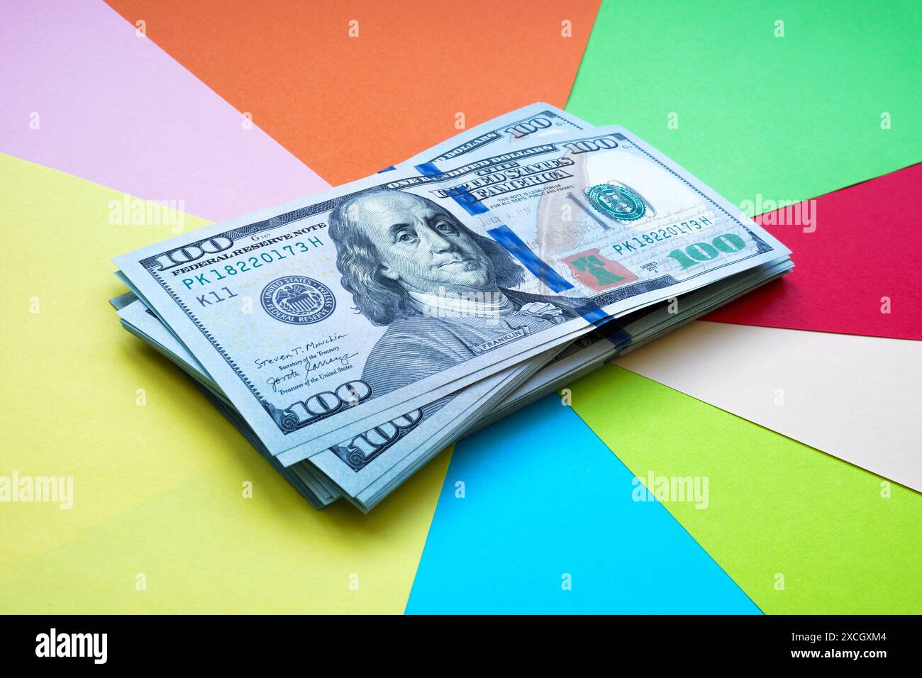 Money on sheets of colored paper. Creative economy concept Stock Photo ...