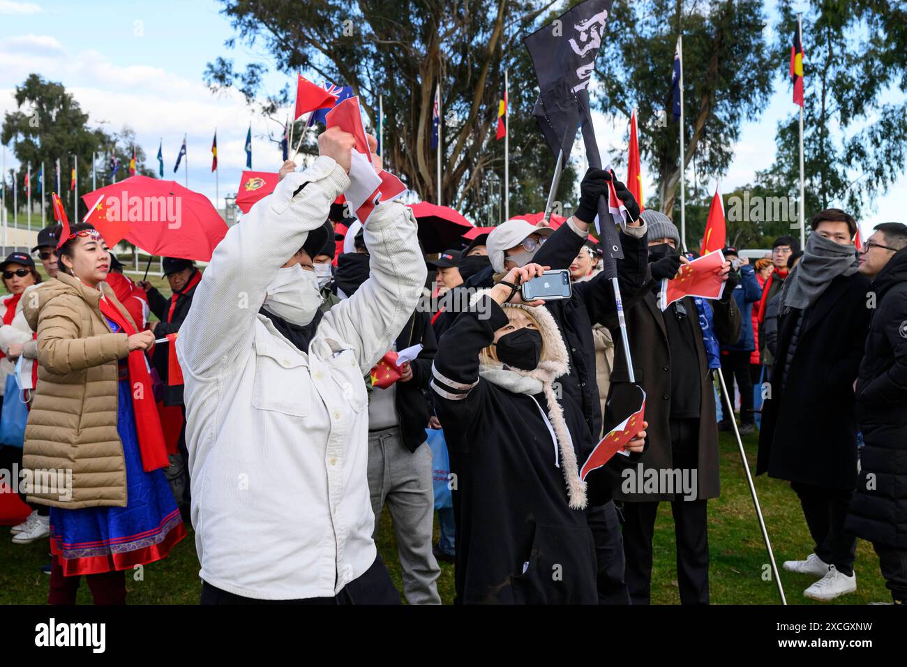 Protesters from the Hong Kong community seen tearing the national flag ...