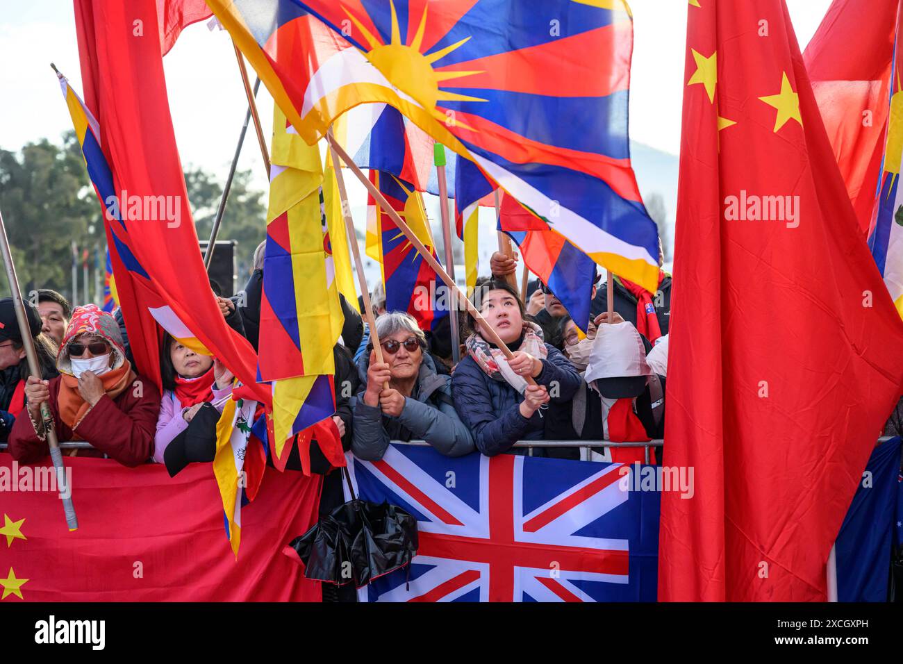 Protesters from the Tibet, Hong Kong, East Turkistan community waving ...