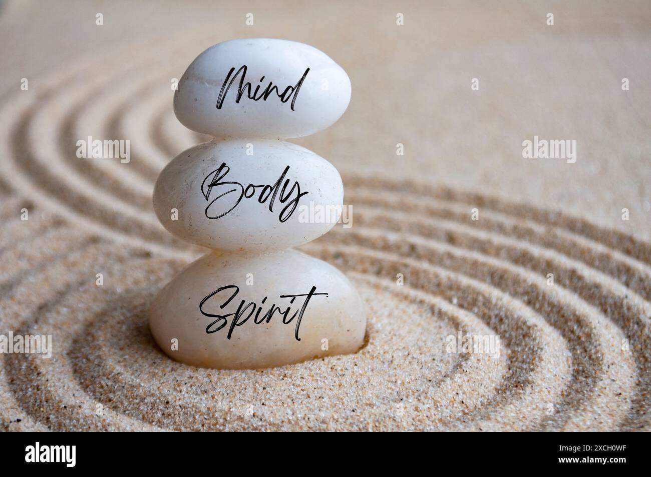 Mind, body and soul text on zen stones with sand background. Meditation ...
