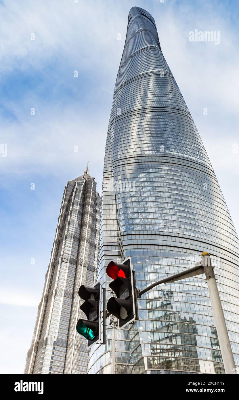 Traffic light in red and green in front of the skyscrapers in Shanghai ...