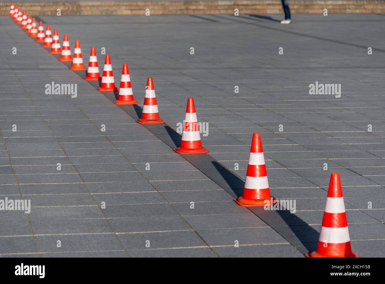 Line Of Traffic Cones Standing In A Large Empty Square Stock Photo - Alamy
