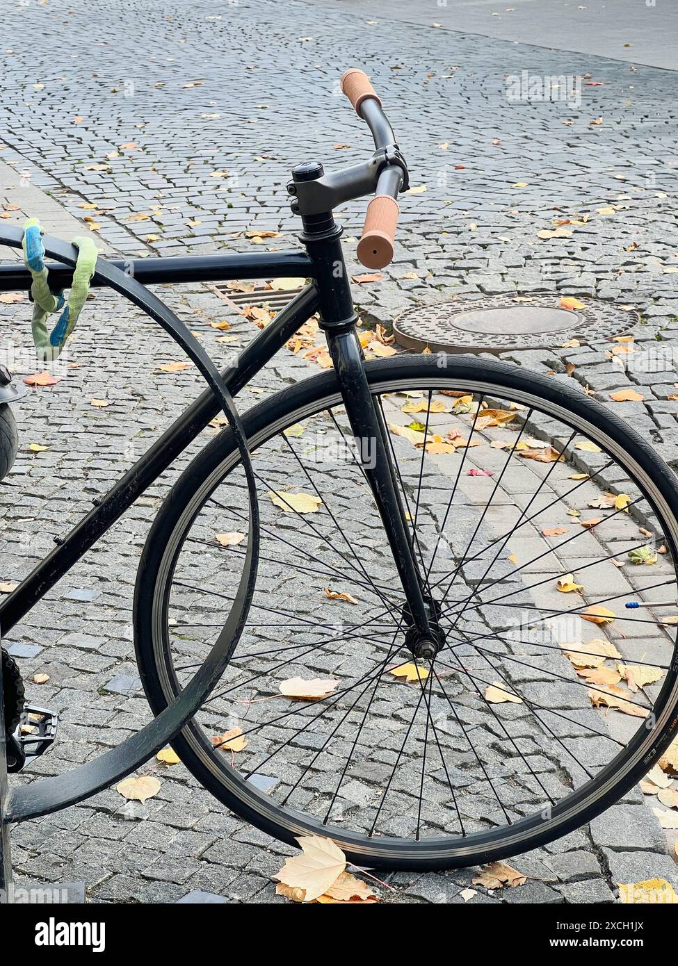 Cropped view of black fixed-gear bicycle, commonly known as a fixie on ...