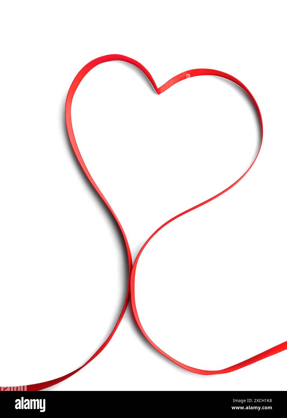 red heart ribbon bow isolated on white background Stock Photo - Alamy