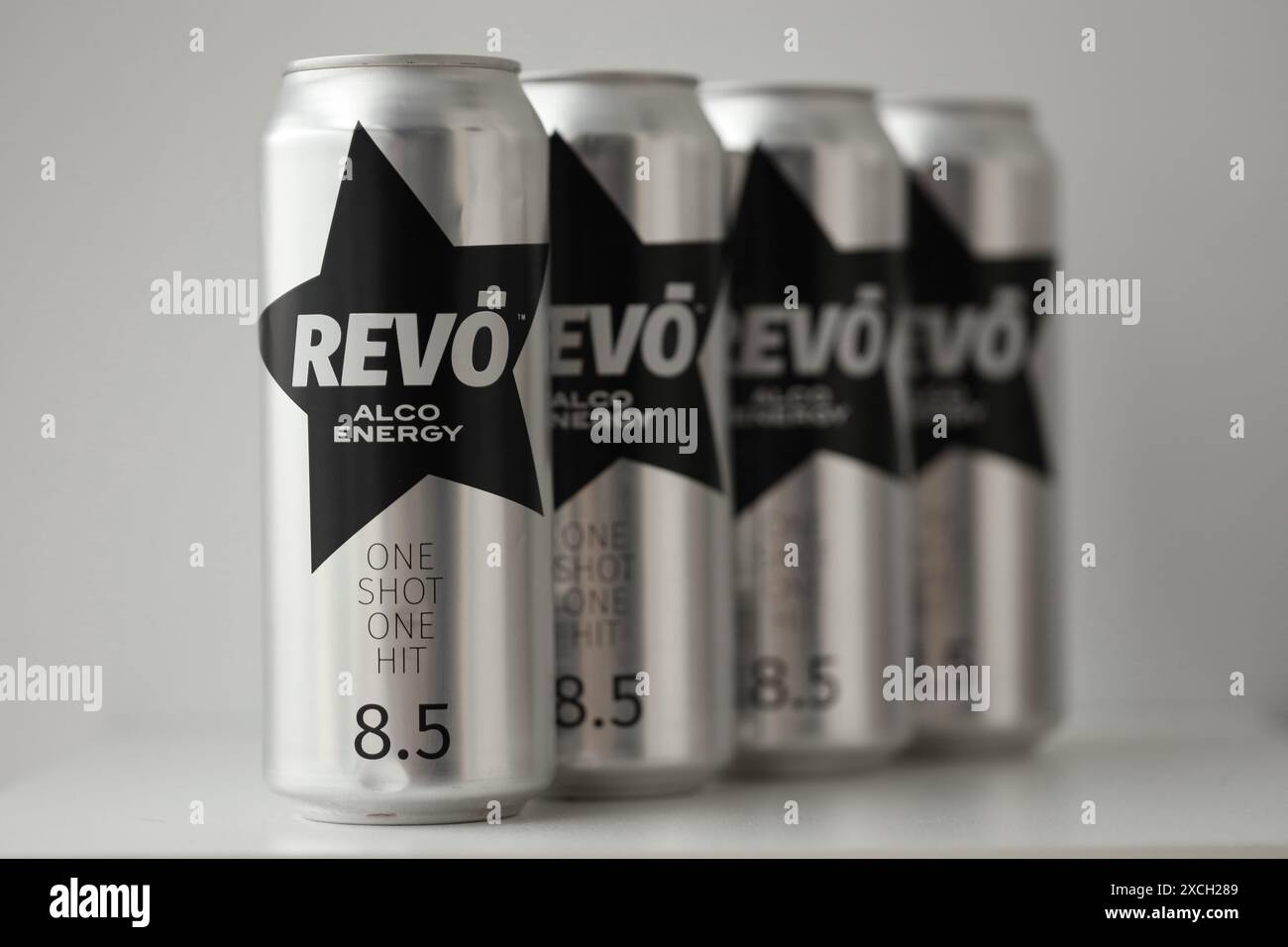 KYIV, UKRAINE - APRIL 20, 2024 Cans of Revo alco energy drink in new ...