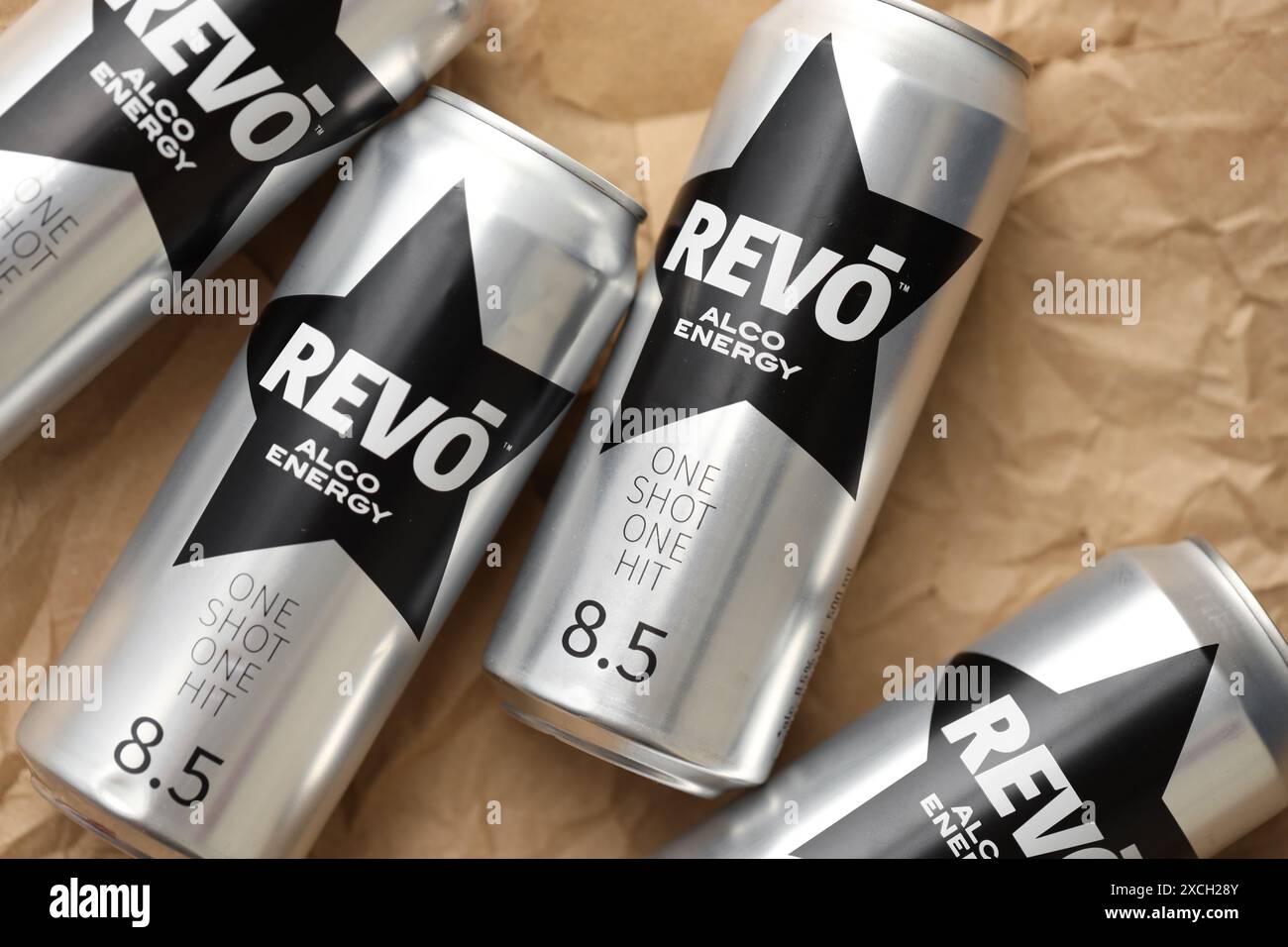 KYIV, UKRAINE - APRIL 20, 2024 Cans of Revo alco energy drink in new ...