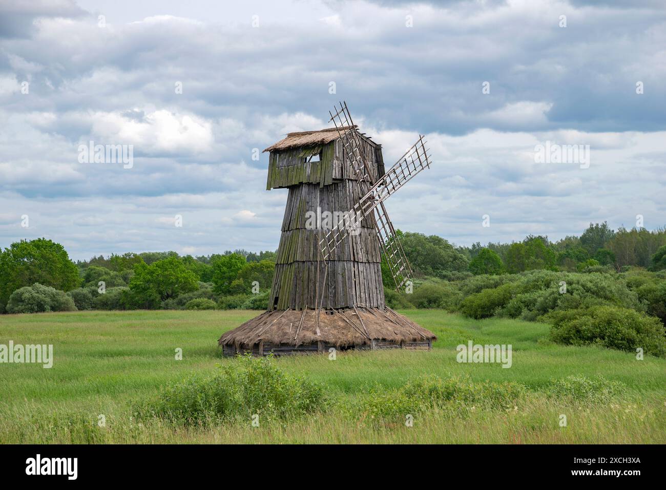 An old wooden windmill in a field. Pskov region, Russia Stock Photo - Alamy