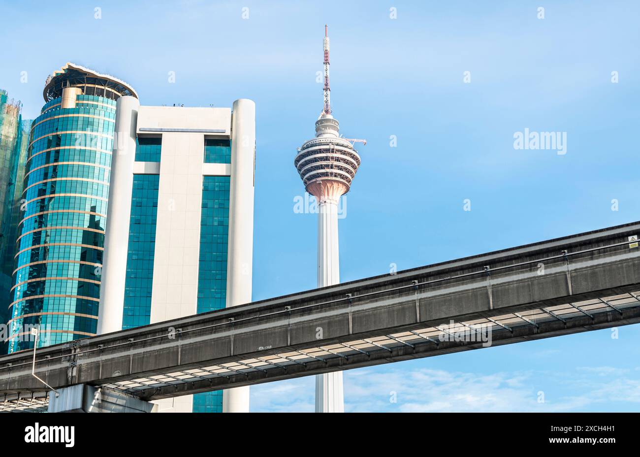 A modern efficient transport network,running atop tall concrete pillars ...