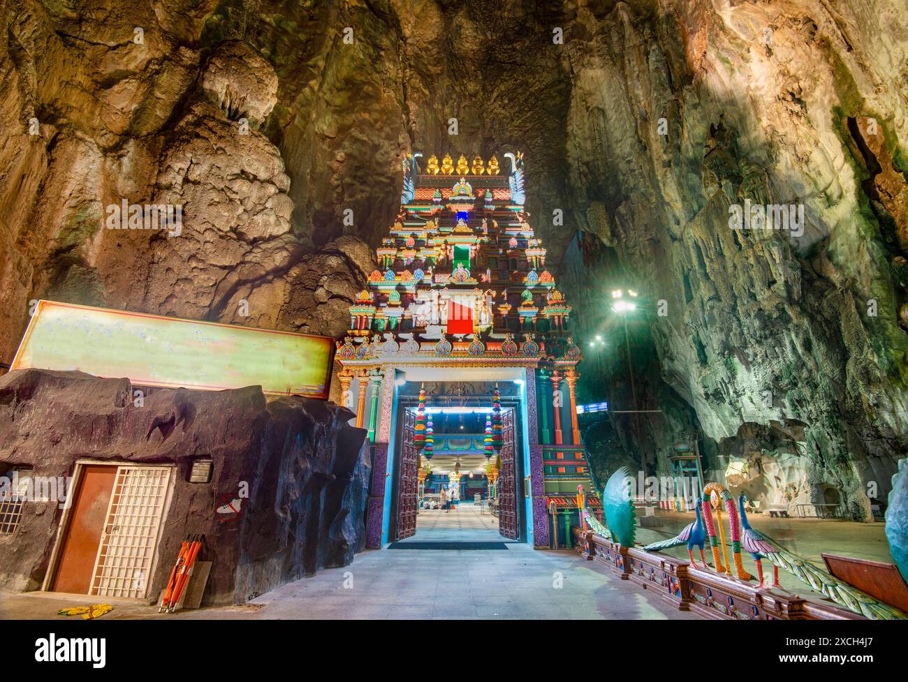 Beautiful renovated ornate temple,within the vast interior of the cave ...