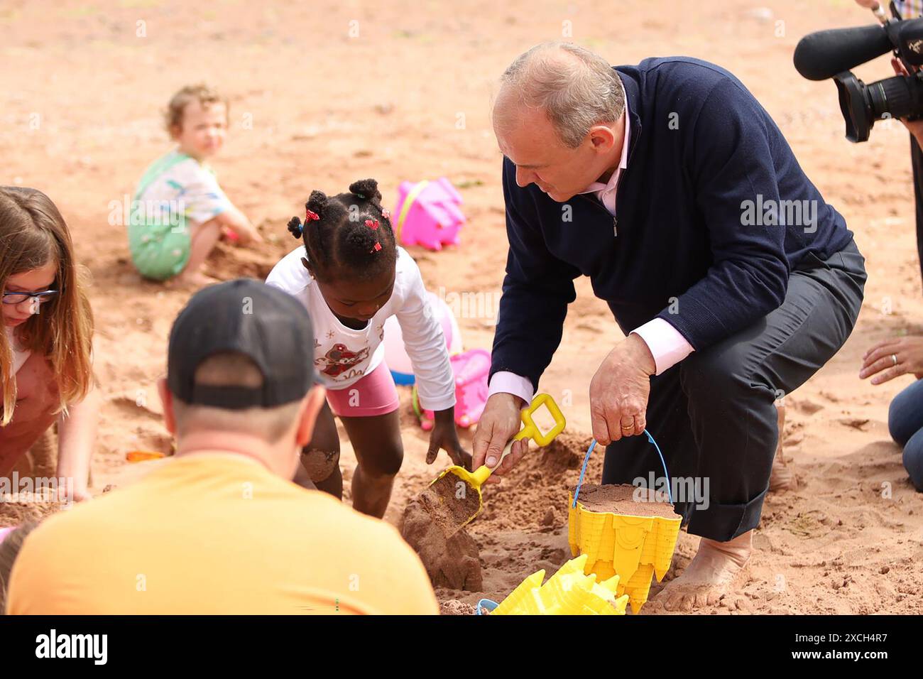 Liberal Democrats leader Sir Ed Davey builds sandcastles with children ...