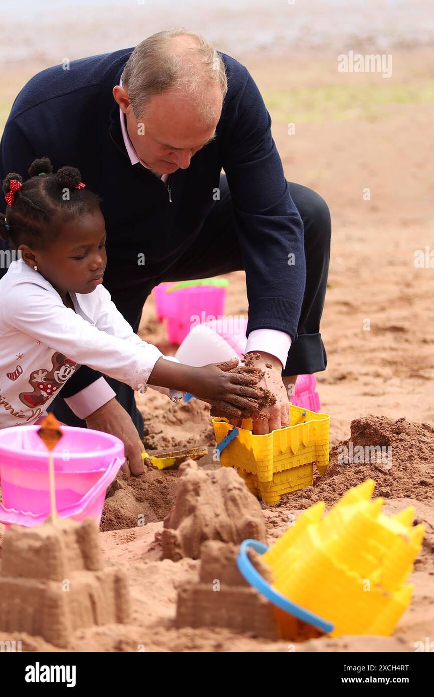 Liberal Democrats leader Sir Ed Davey builds sandcastles with children ...