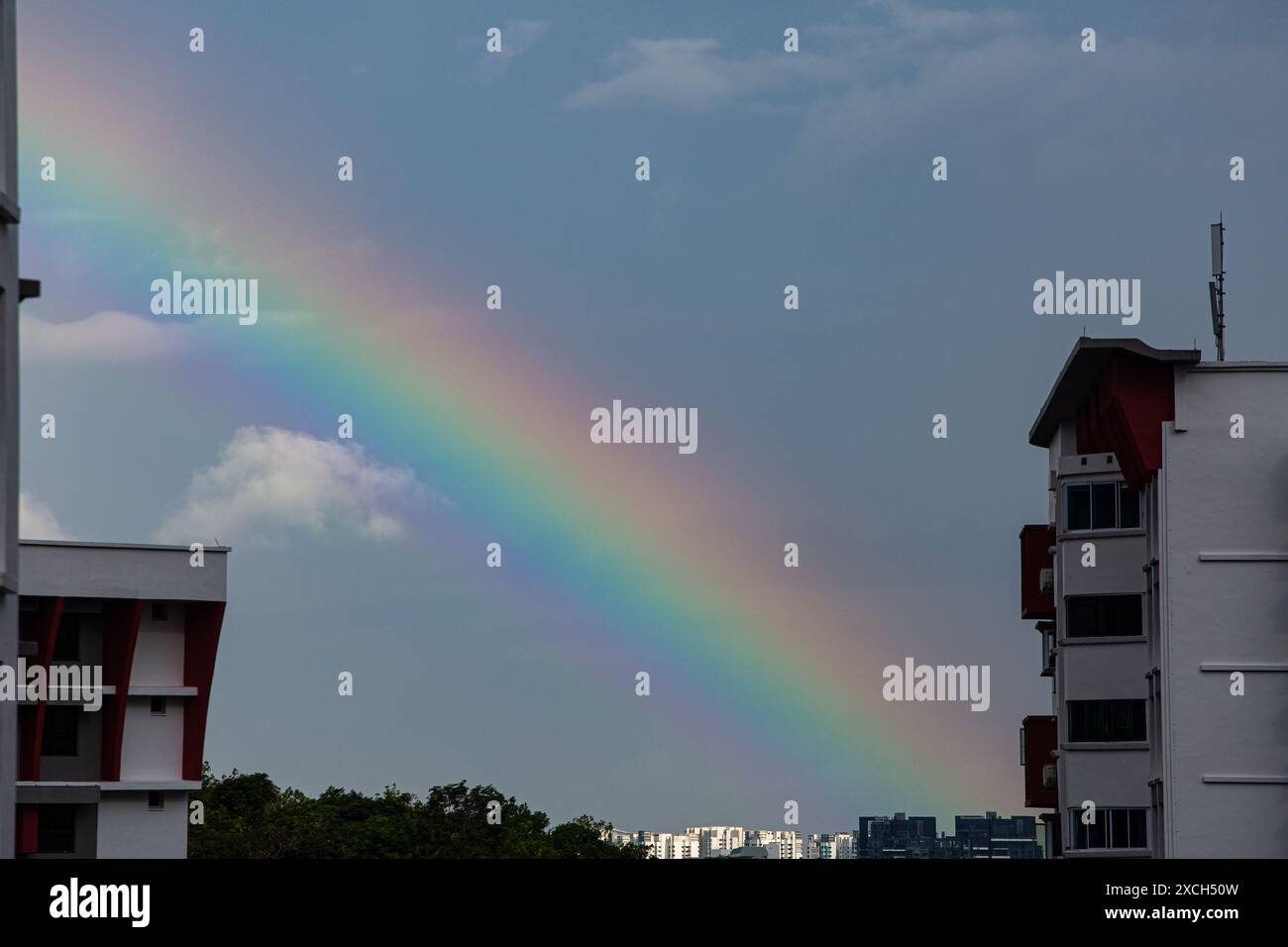 Partial rainbow arc appears on sky, Singapore Stock Photo - Alamy