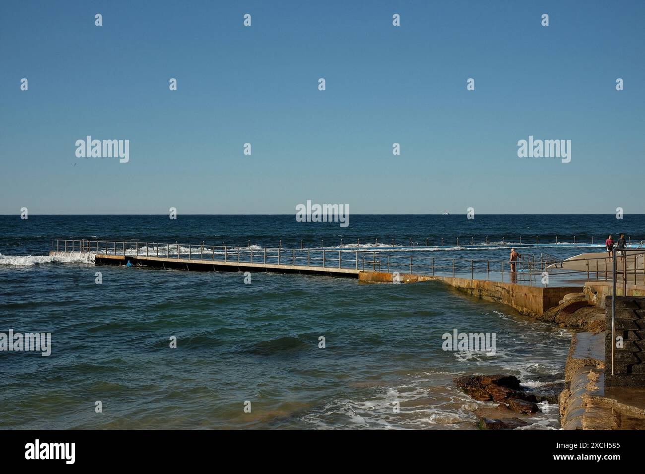 Collaroy Ocean Pool, Sydney, Australia a concrete pool surrounded by a ...