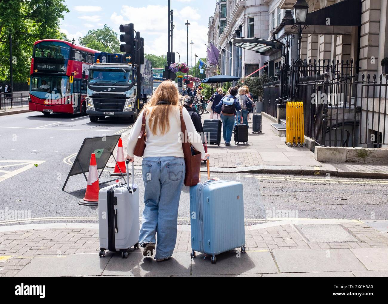 Tourists pulling their luggage behind them in Piccadilly London , England , UK Stock Photo - Alamy