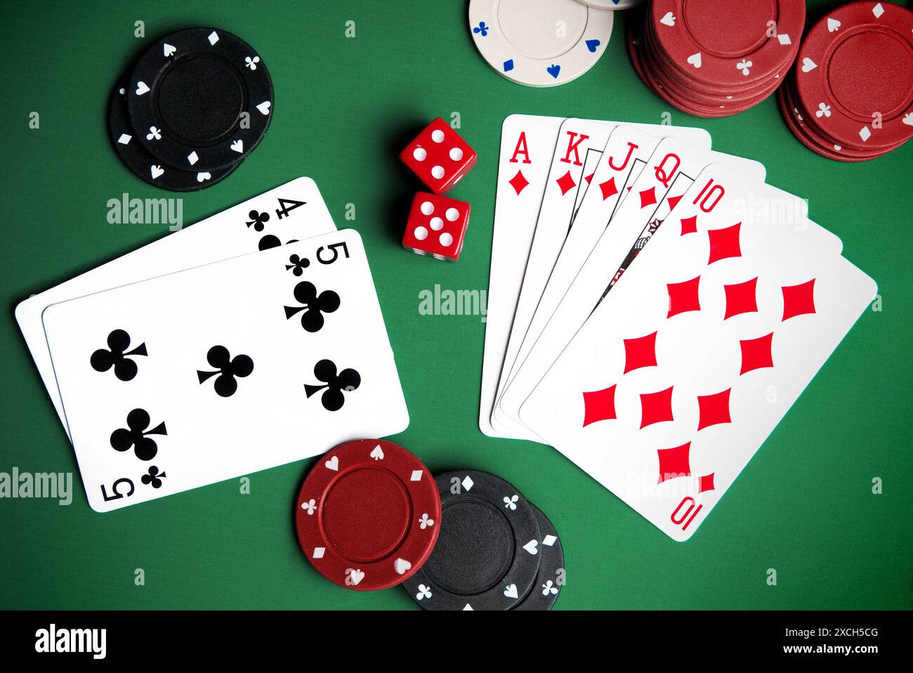 playing cards and chips on a green background Stock Photo - Alamy