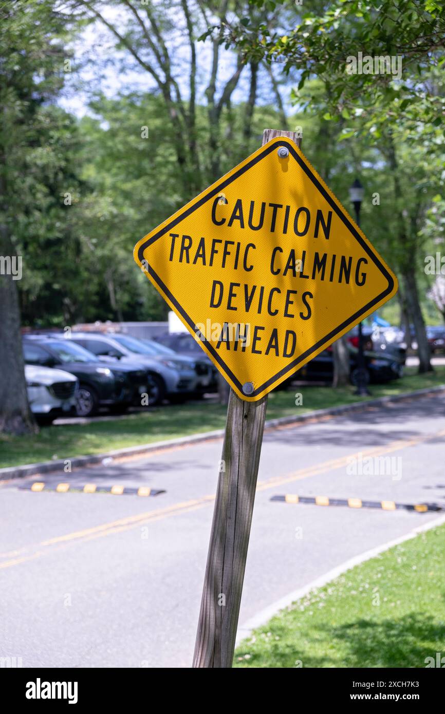 A road sign about speed bumps to slow down drivers referred to as ...