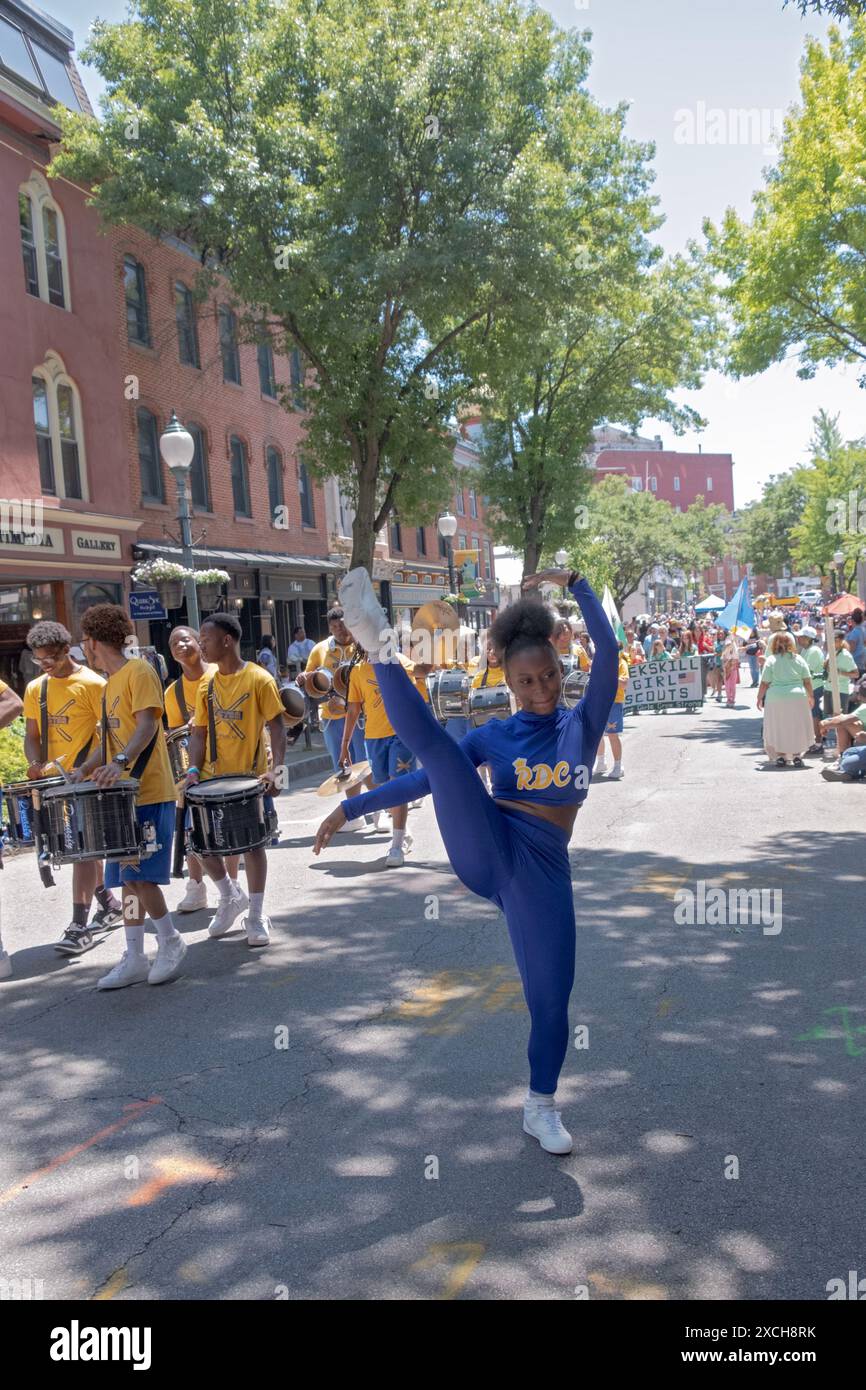 A dancer from the Royalettes dance company kicking a high kick at the ...
