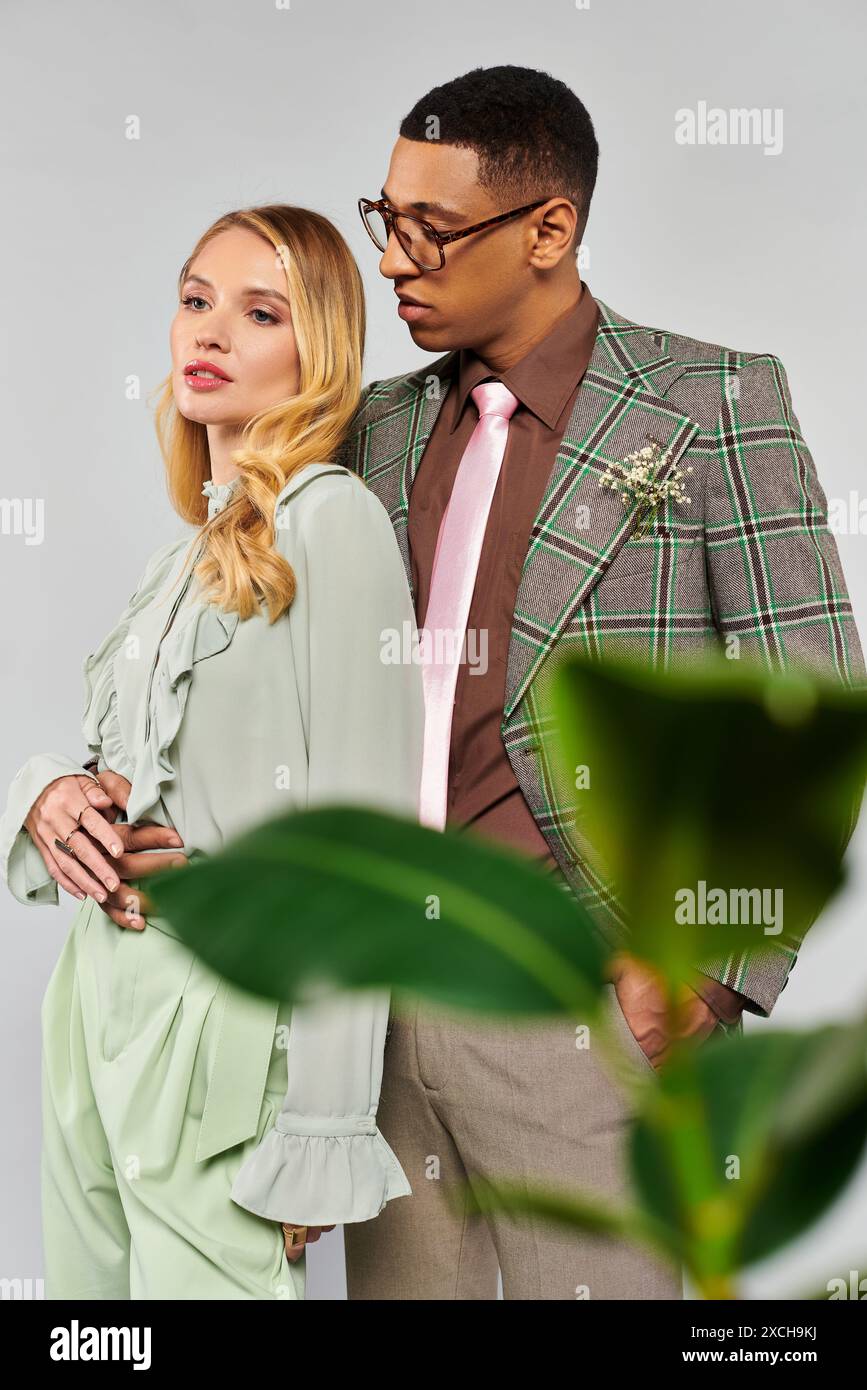 Man and woman striking a pose in a loving embrace Stock Photo - Alamy