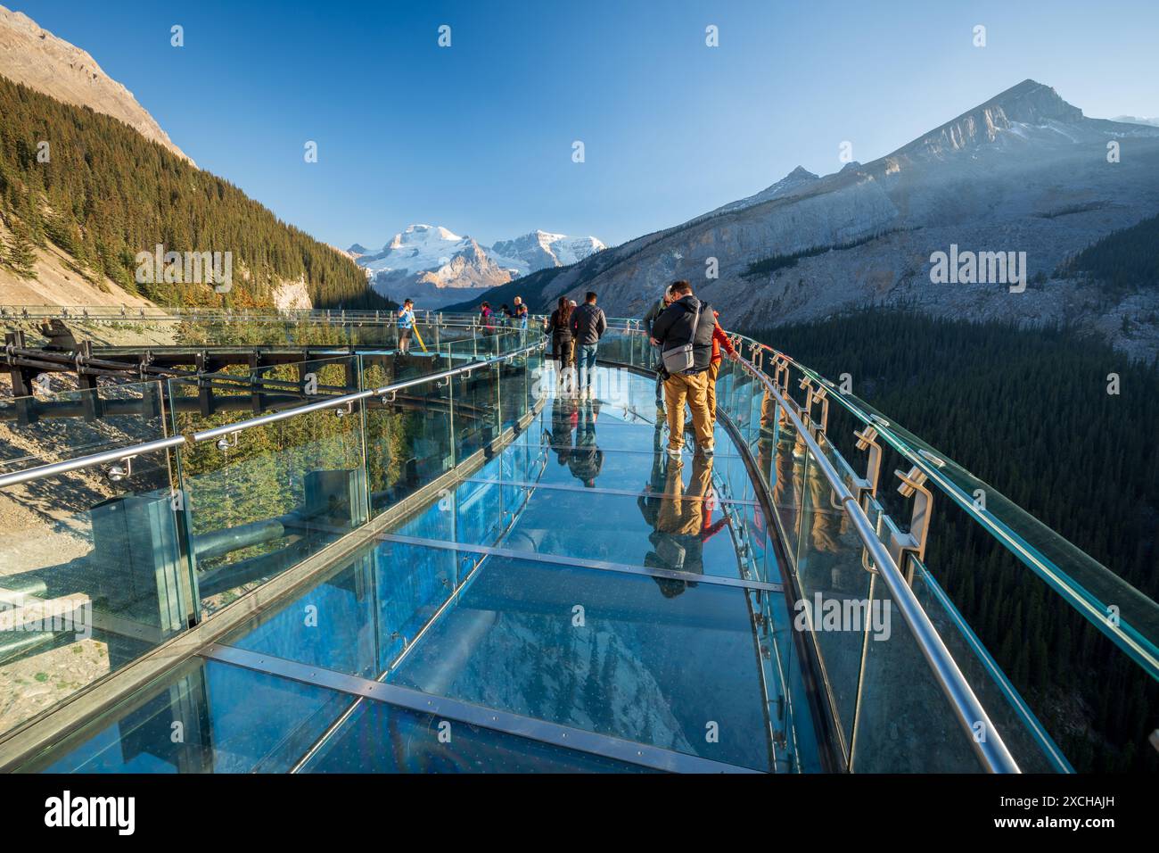 Columbia Icefield Skywalk. Tourists standing on glass floored ...