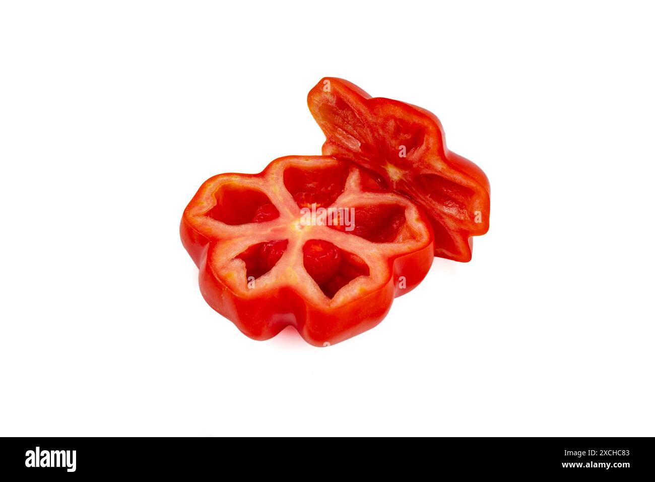 Sliced in half flower shaped tomato fruit, huge hollow tomato top view ...