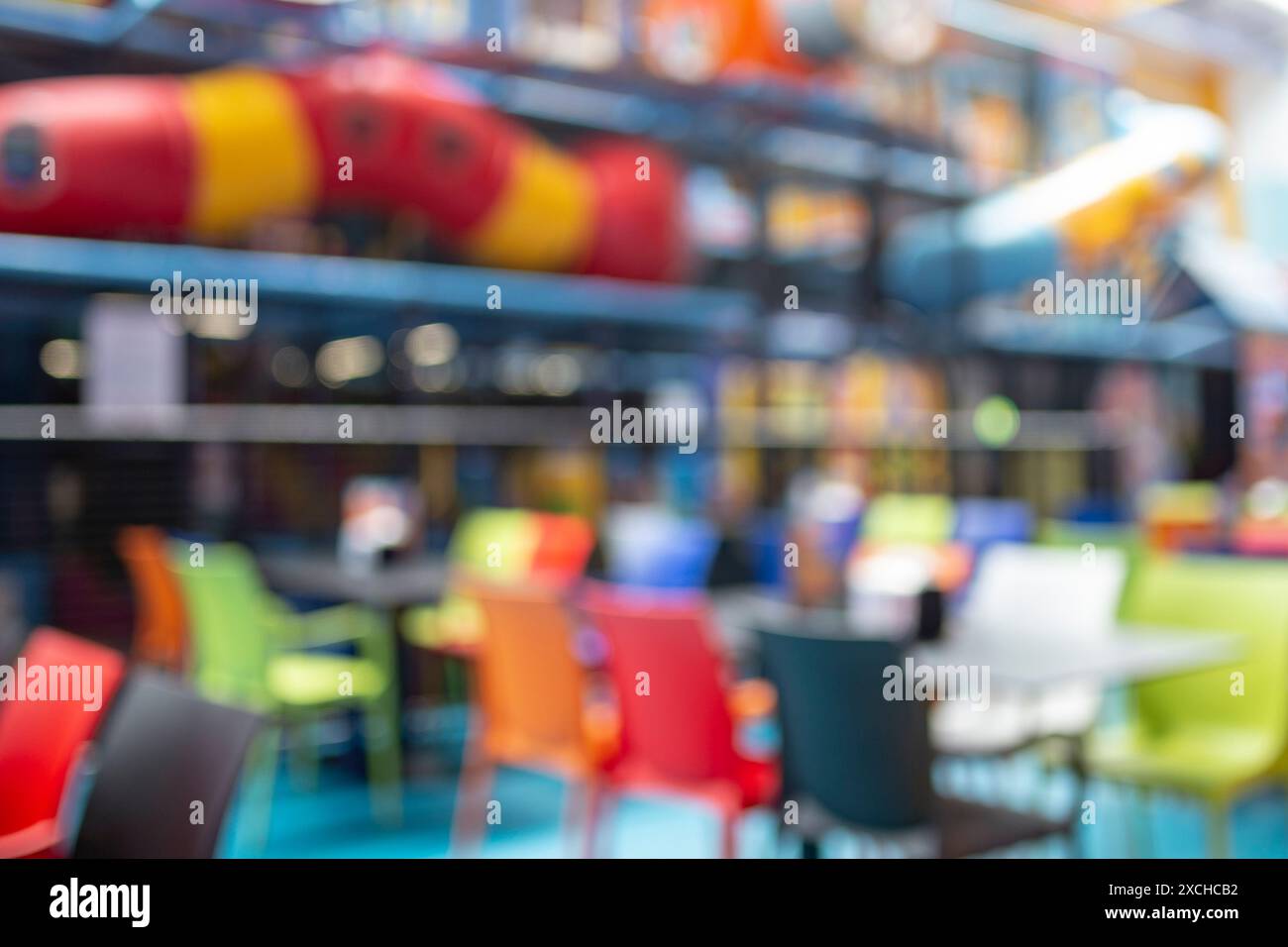 Defocused indoor playground, blurred amusement park for children ...