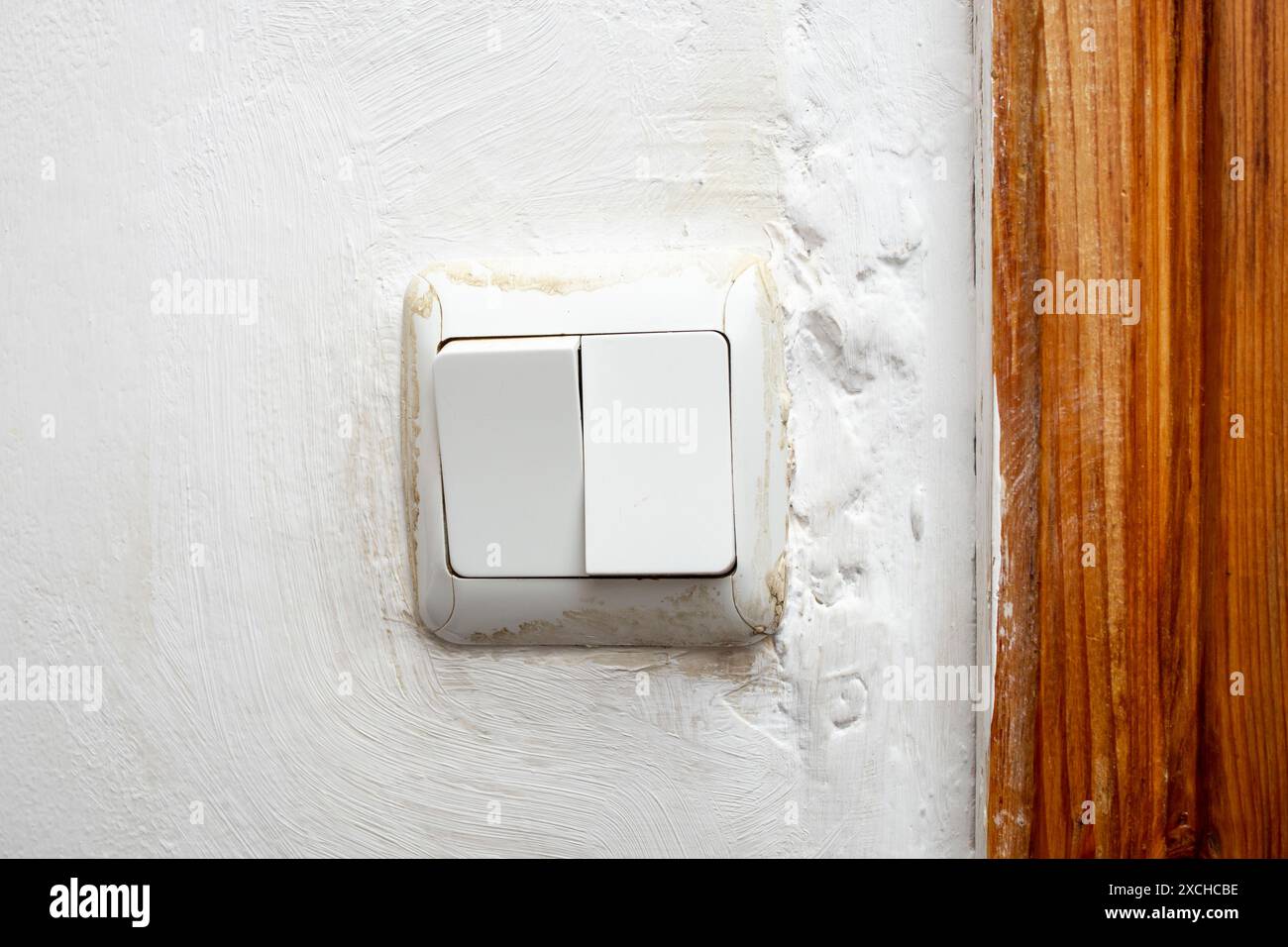 Dirty light switch on white painted wall cement texture, close up Stock ...