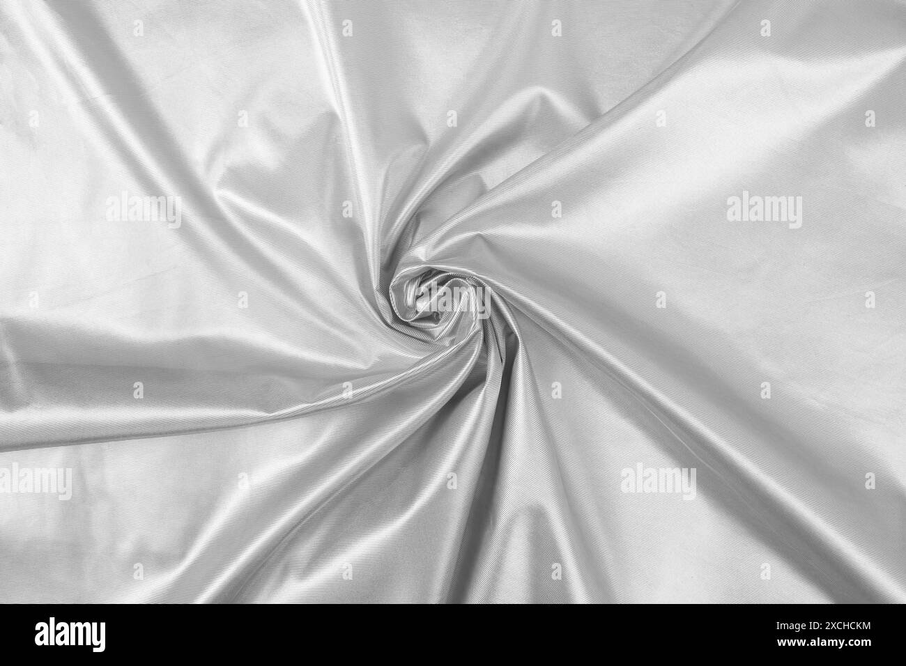 Metallic silver fabric texture with spiral swirl, abstract pattern ...