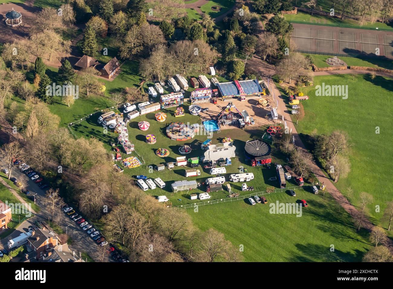 Aerial photo of travelling fairground set up in field near ...