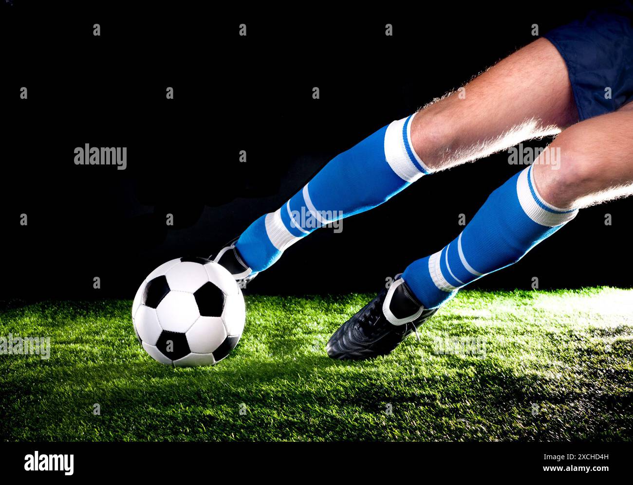 Football in leg green hi-res stock photography and images - Alamy