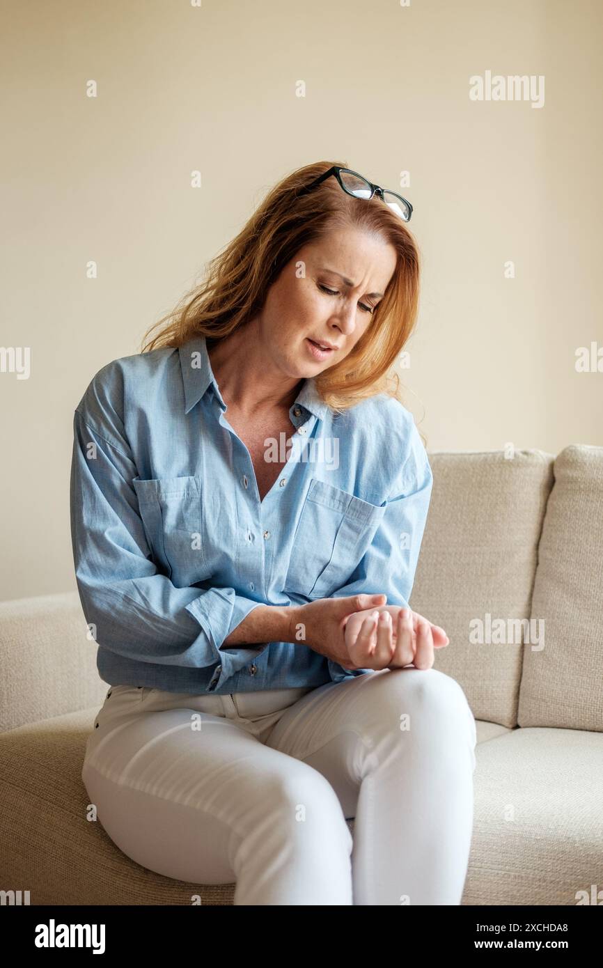 A red haired woman in her early 40s suffers with invisible pain ...