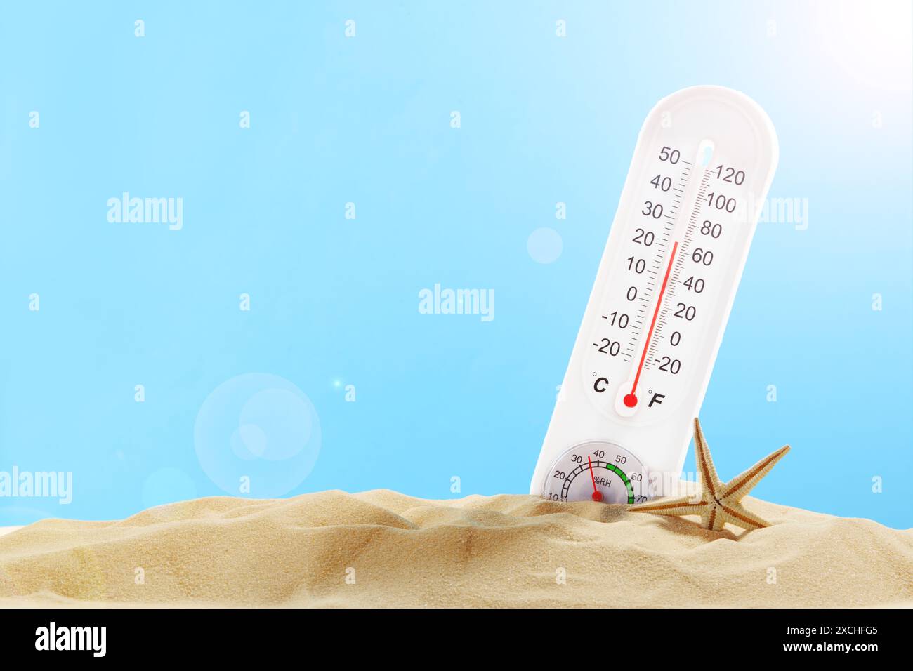 White Thermometer Measuring Summer Heat on Sandy Beach Stock Photo - Alamy