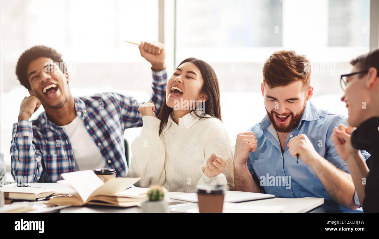 Motivated students celebrating finished learning for test Stock Photo ...