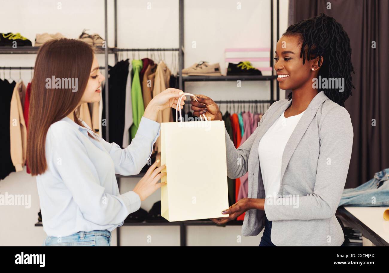 Two Women Shopping in a Clothing Store Stock Photo - Alamy