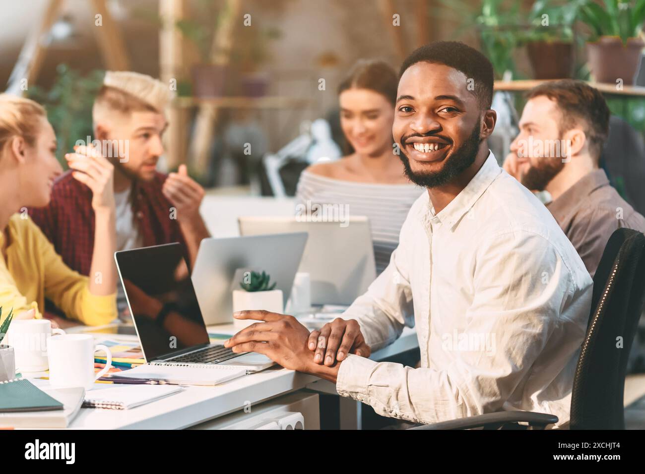 Group of People Working on Laptops at Table Stock Photo - Alamy