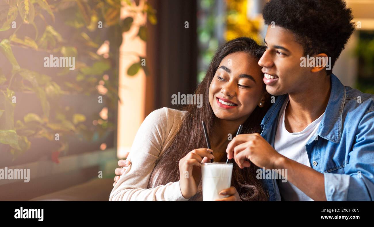Young Guy and Girl Drinking Milkshake in Cafe, Copy Space Stock Photo ...