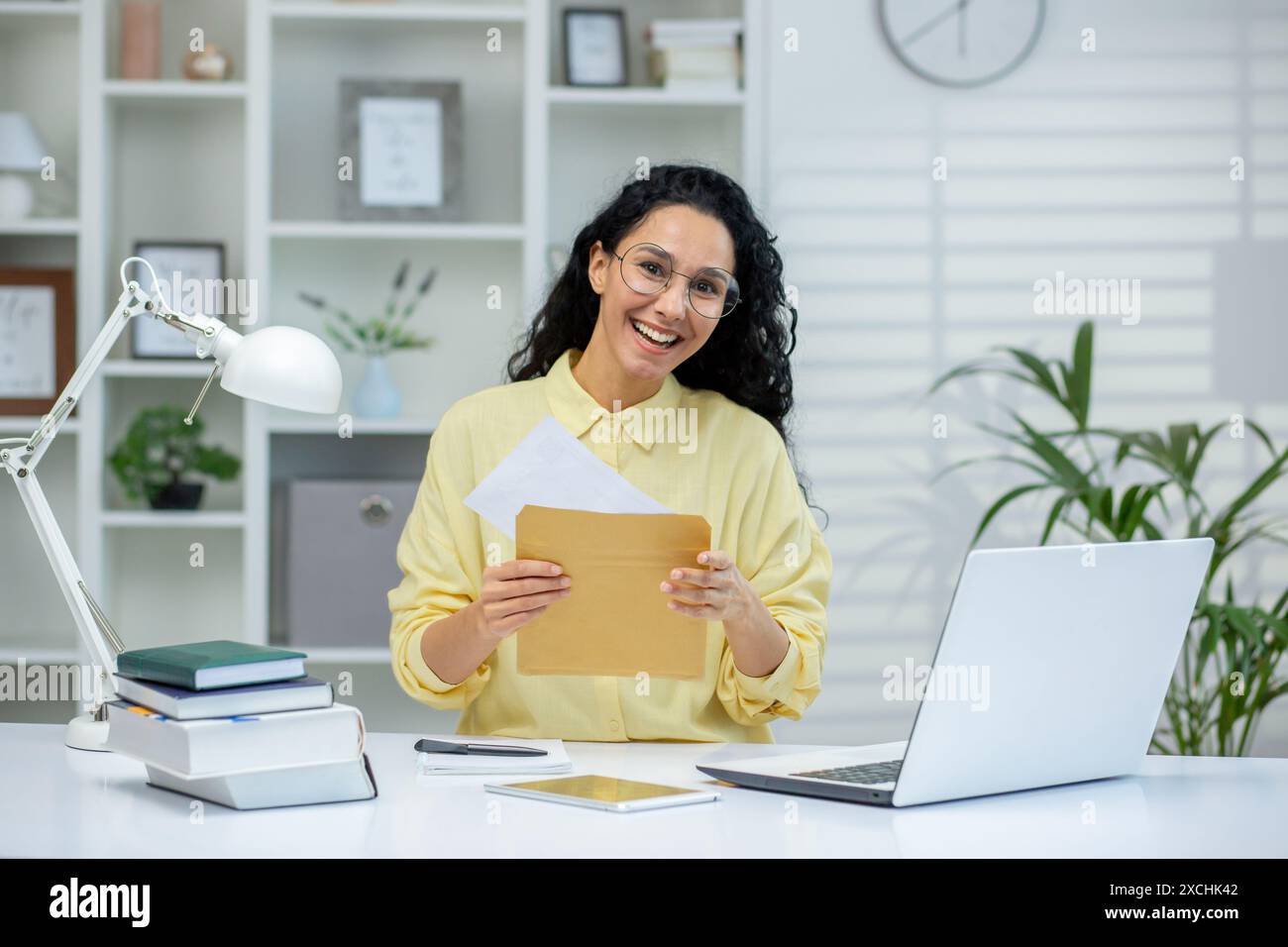 A happy student who received her university acceptance letter by mail ...