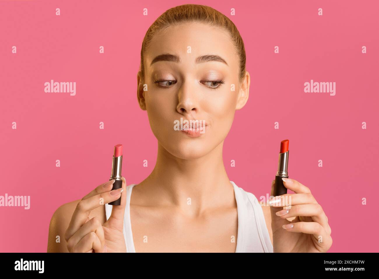 Woman comparing lipstick hi-res stock photography and images - Alamy