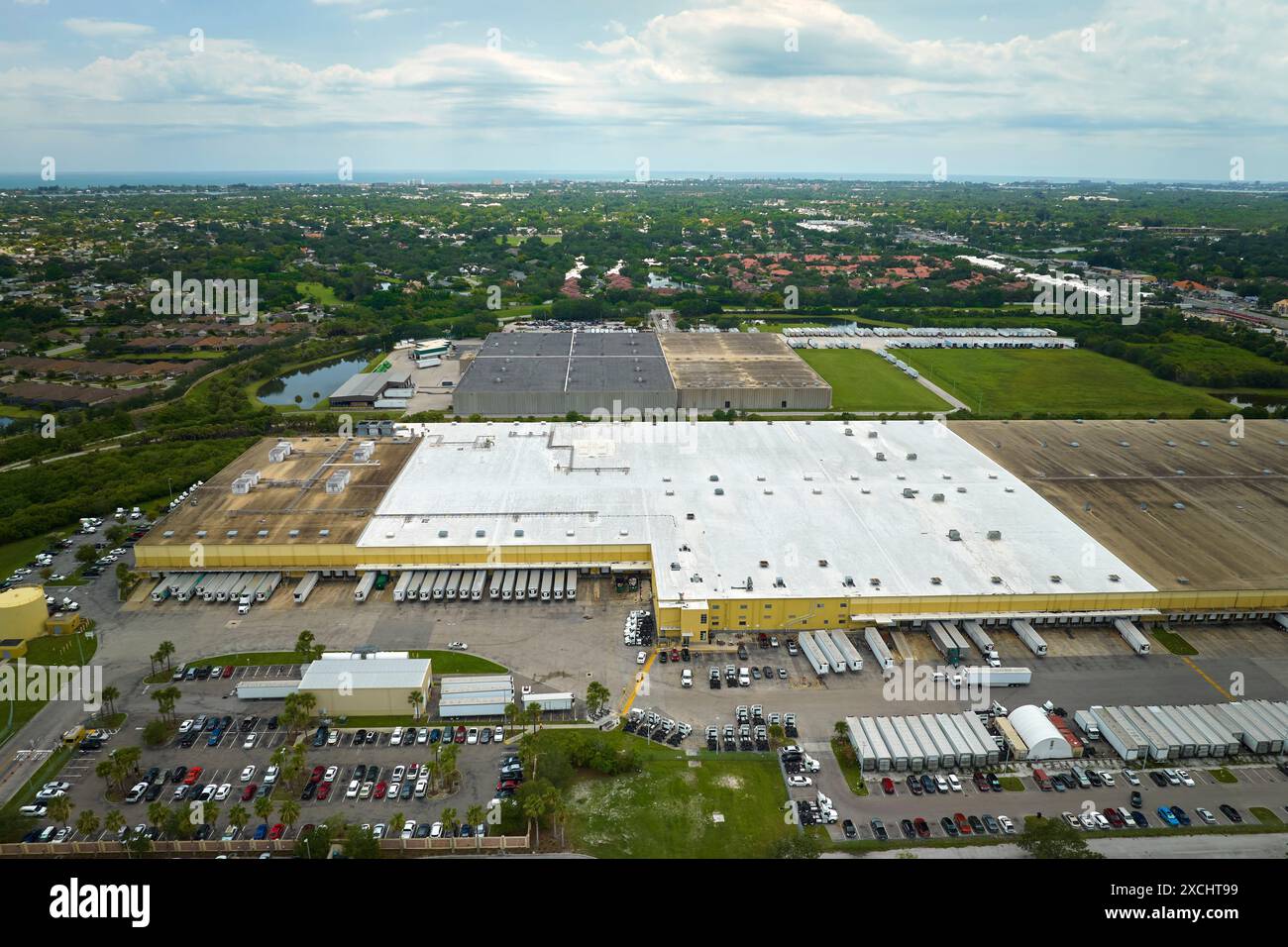 Aerial view of large commercial loading bay with many delivery trucks ...