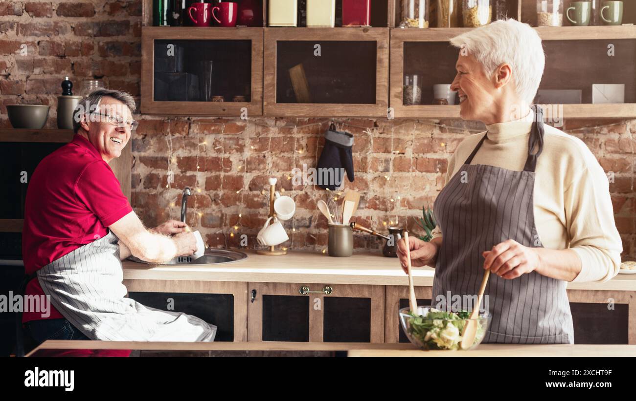 Senior Couple Cooking Together in Modern Kitchen, Have Conversation ...