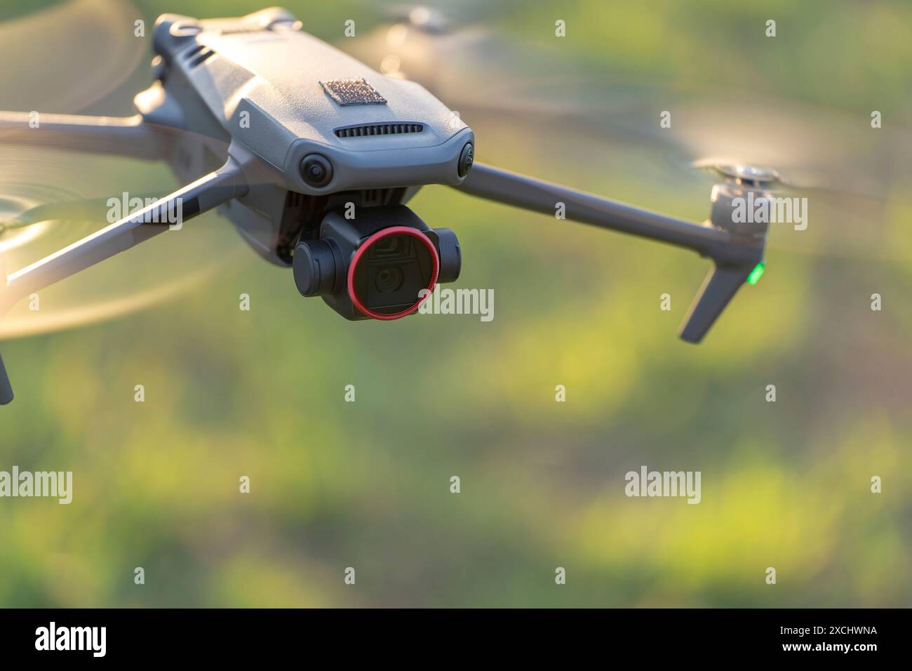 Drone quadcopter with digital camera and fast rotating propellers ...