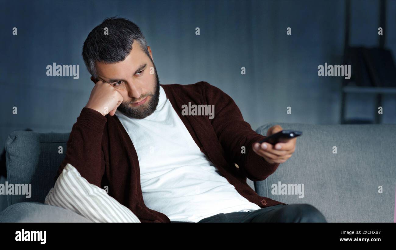 Man watching tv alone in dark hi-res stock photography and images - Alamy