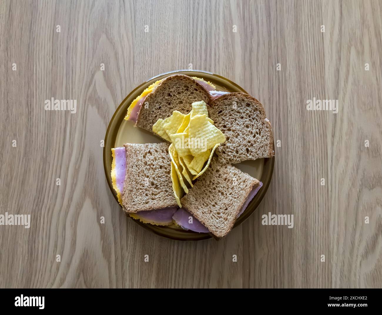 Breaded ham slices in sandwich with crisps Stock Photo - Alamy