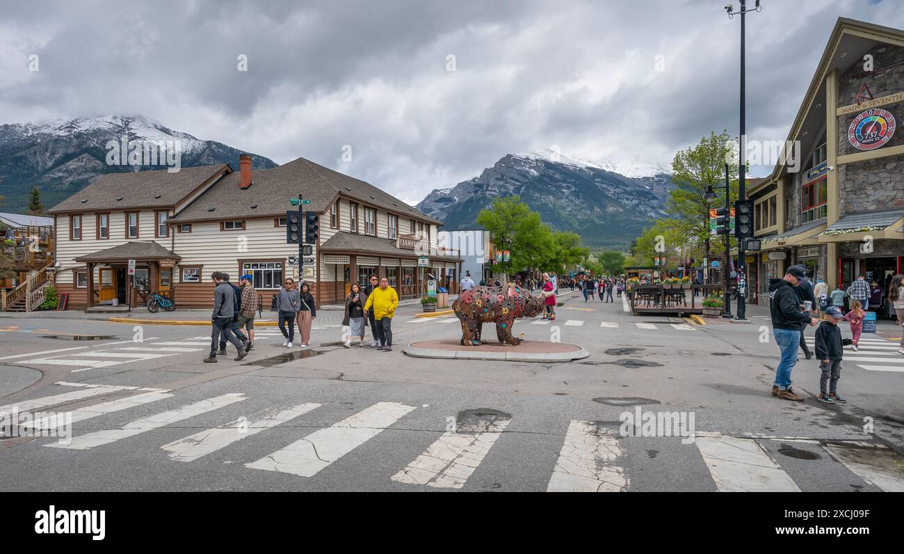 Canmore, Alberta, Canada – June 16, 2024: People enjoy Main Street in ...