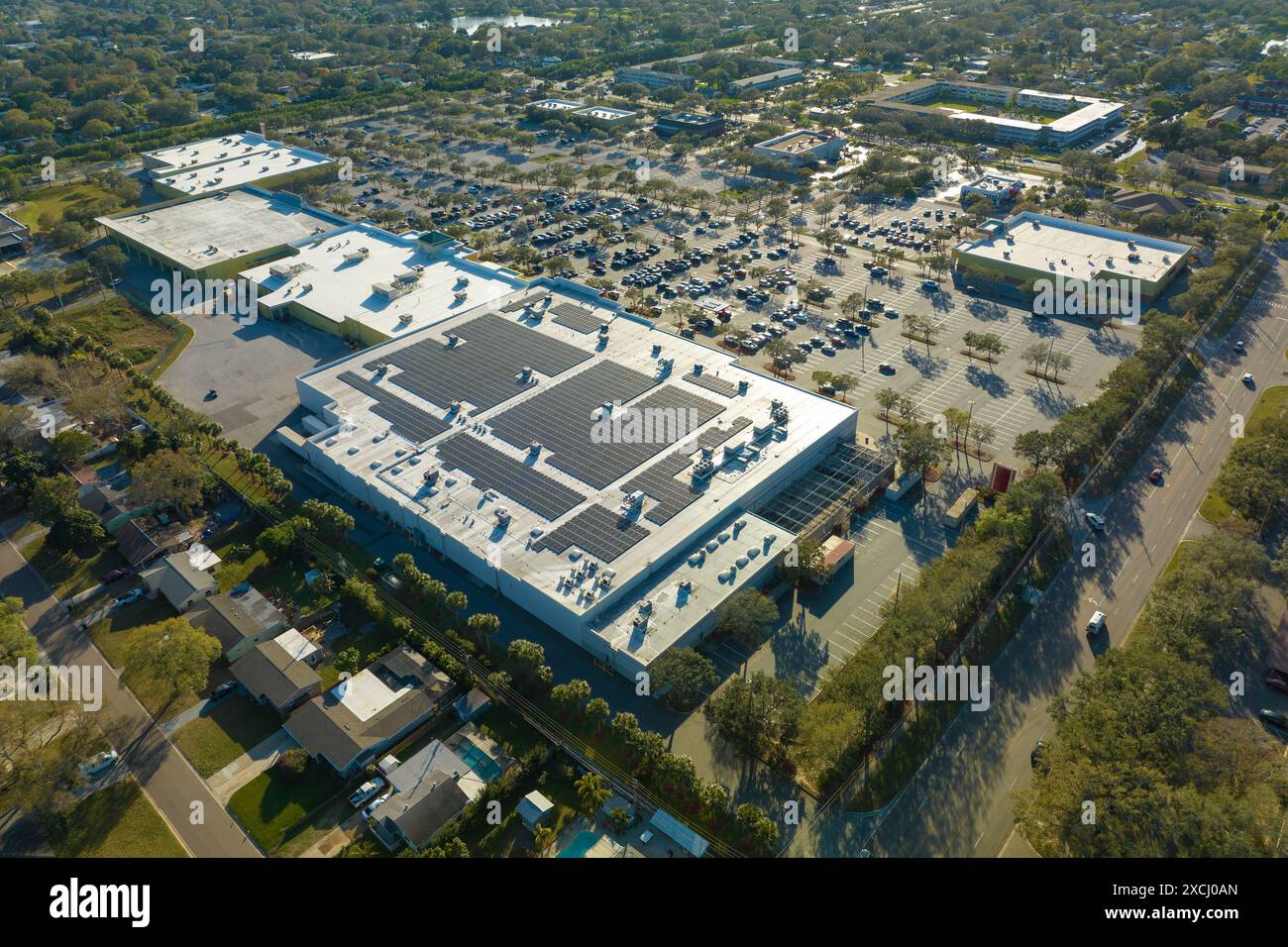 Top view of many cars parked on a parking lot in front of a shopping ...