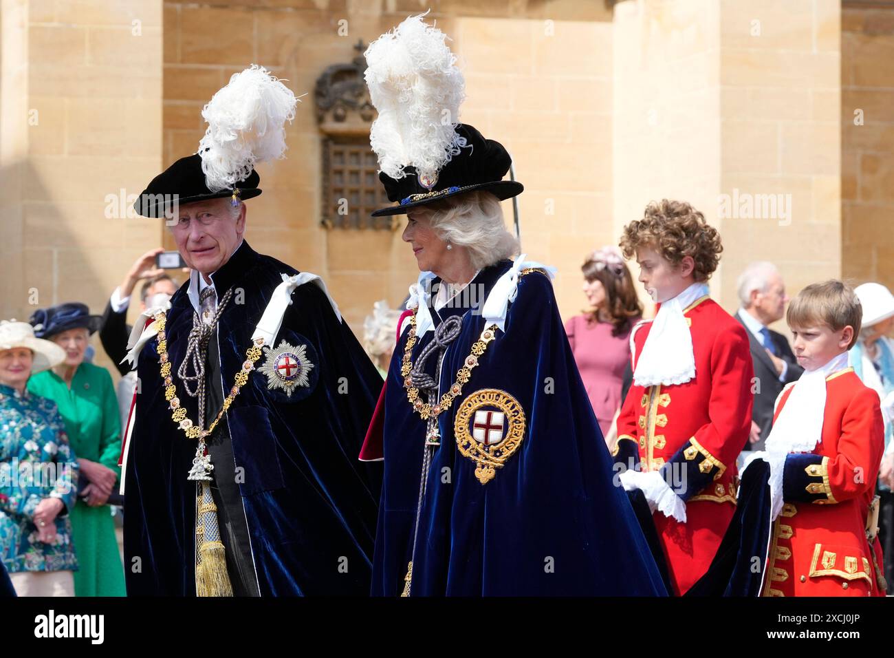 King Charles III and Queen Camilla are followed by Page of Honour ...